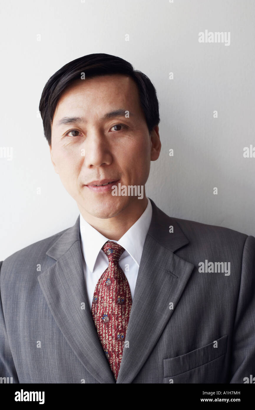 Portrait of a businessman looking serious Stock Photo - Alamy