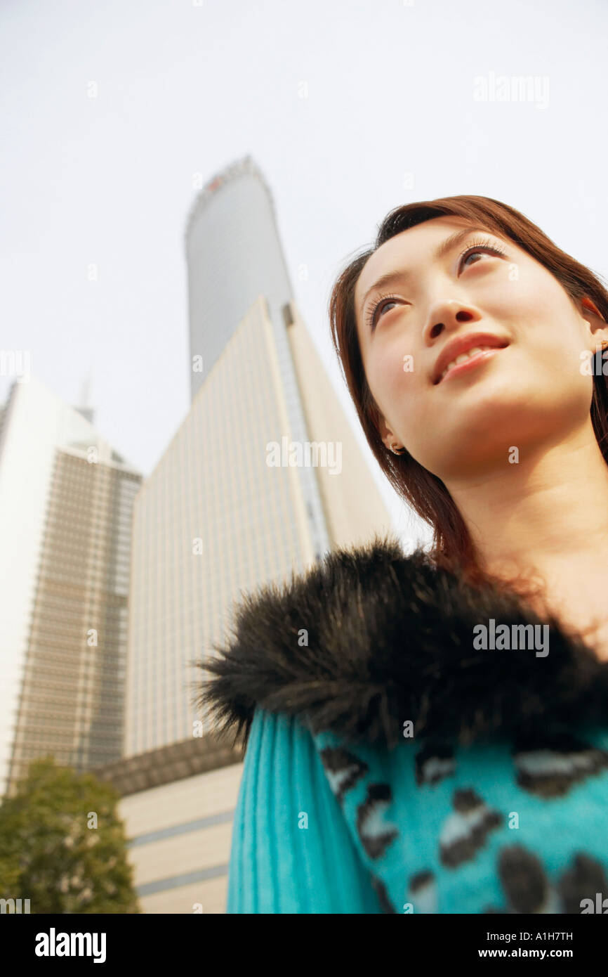 Low angle view of a young woman smiling Stock Photo - Alamy