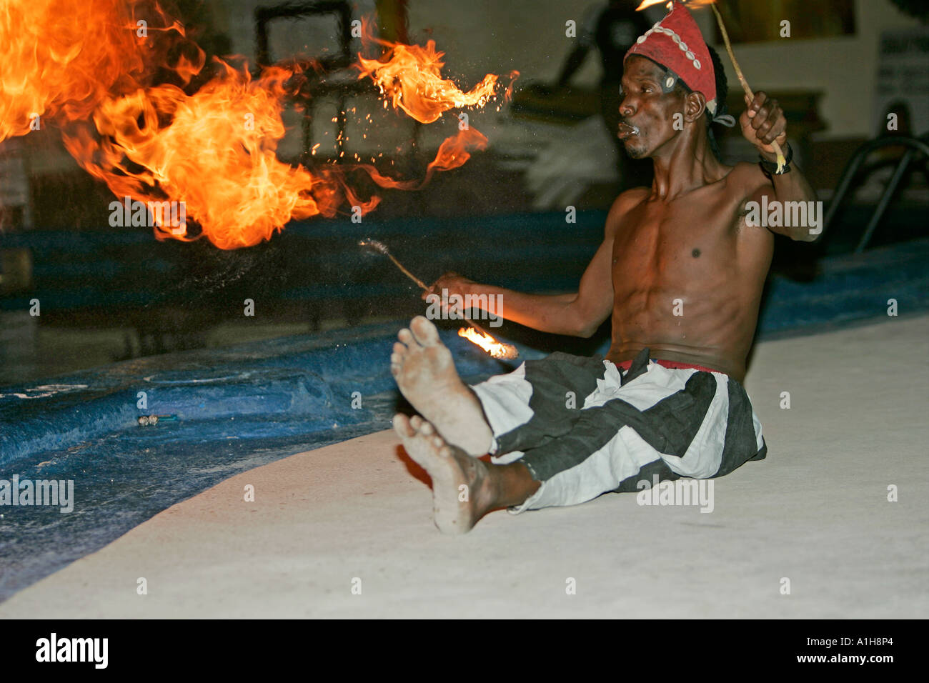 Fire eating dancer performs with drum group Bakau The Gambia Stock ...