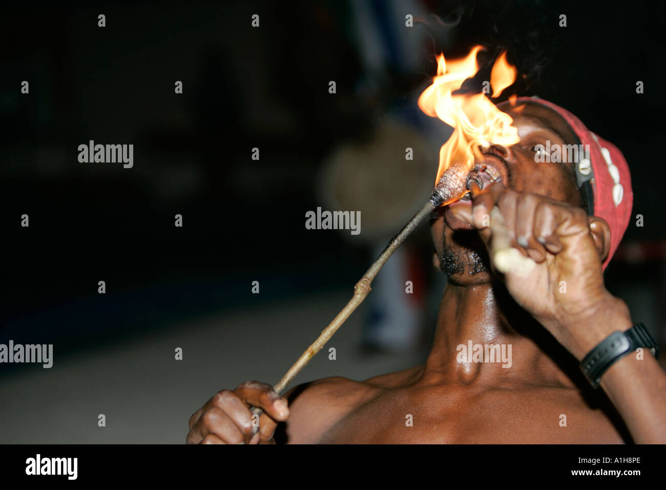 Fire eating dancer performs with drum group Bakau The Gambia Stock ...