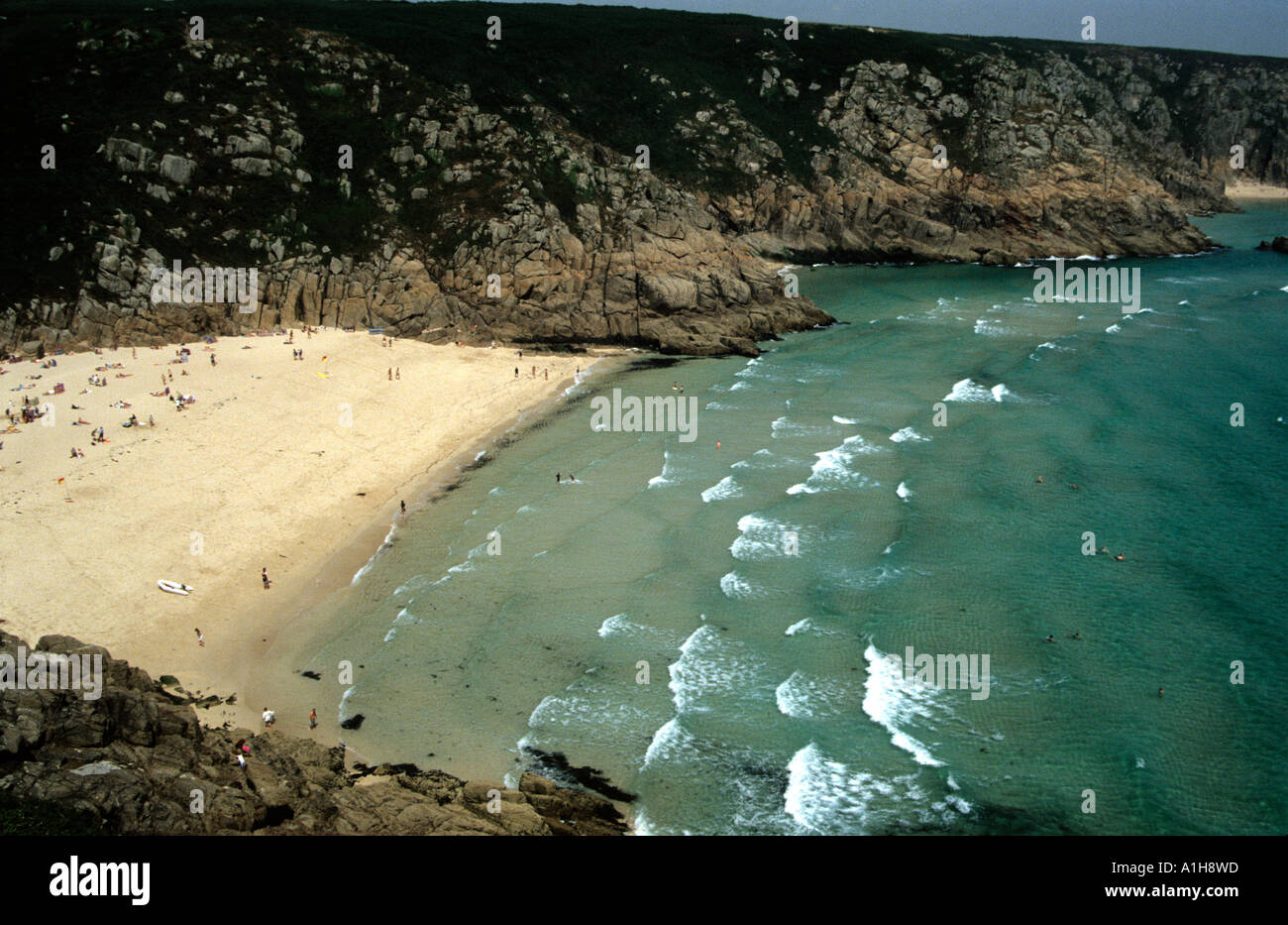 Isolated beach with swimmers Cornwall UK Stock Photo - Alamy