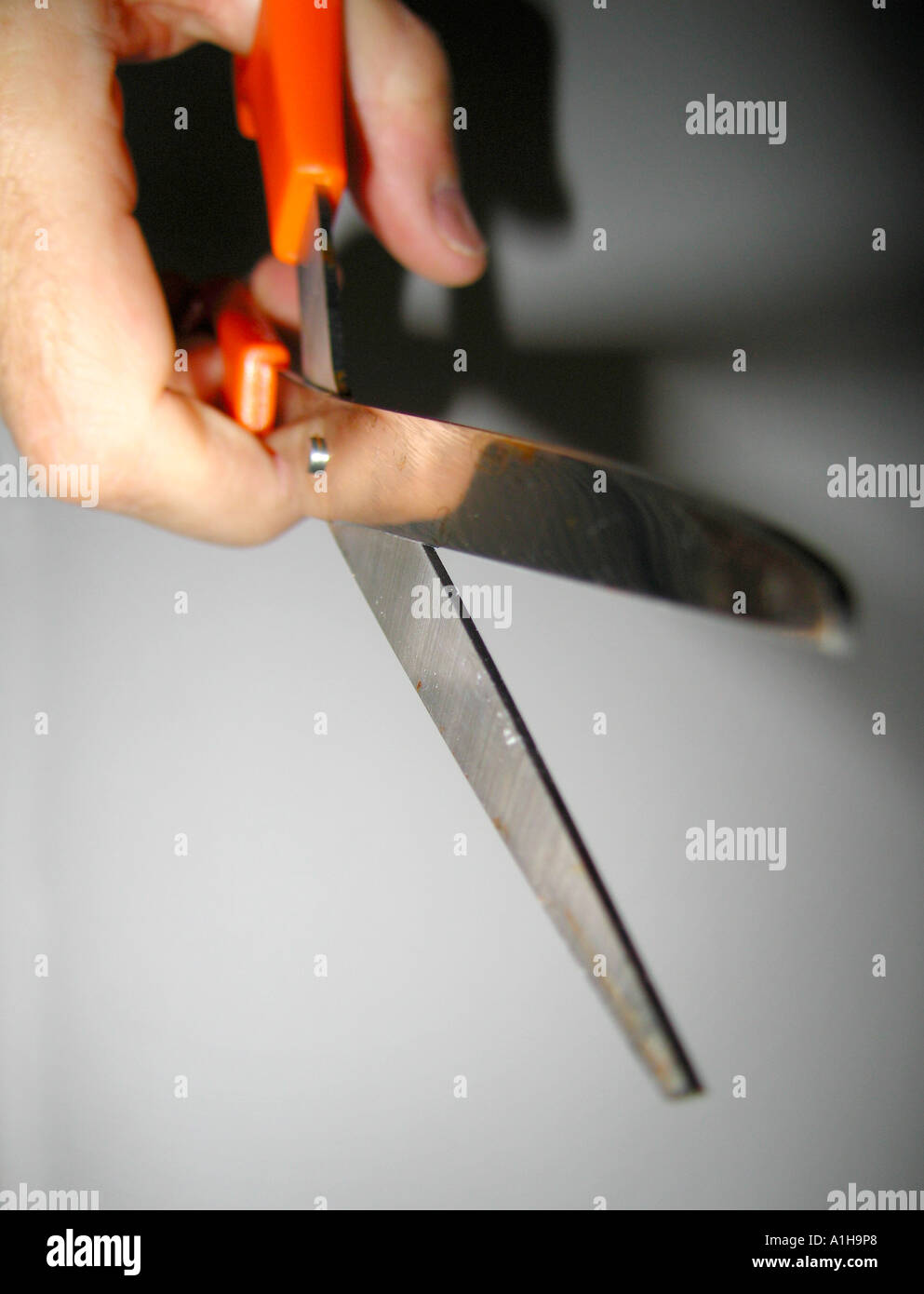 Hand using scissors Stock Photo - Alamy