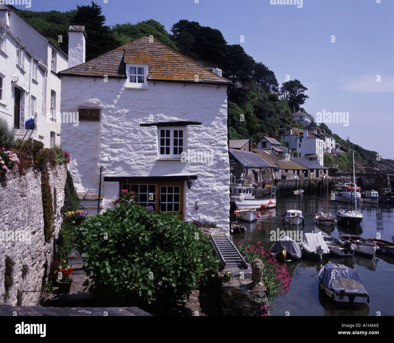 Polperro a fine harbour with its fishing boats on a summers day Stock ...