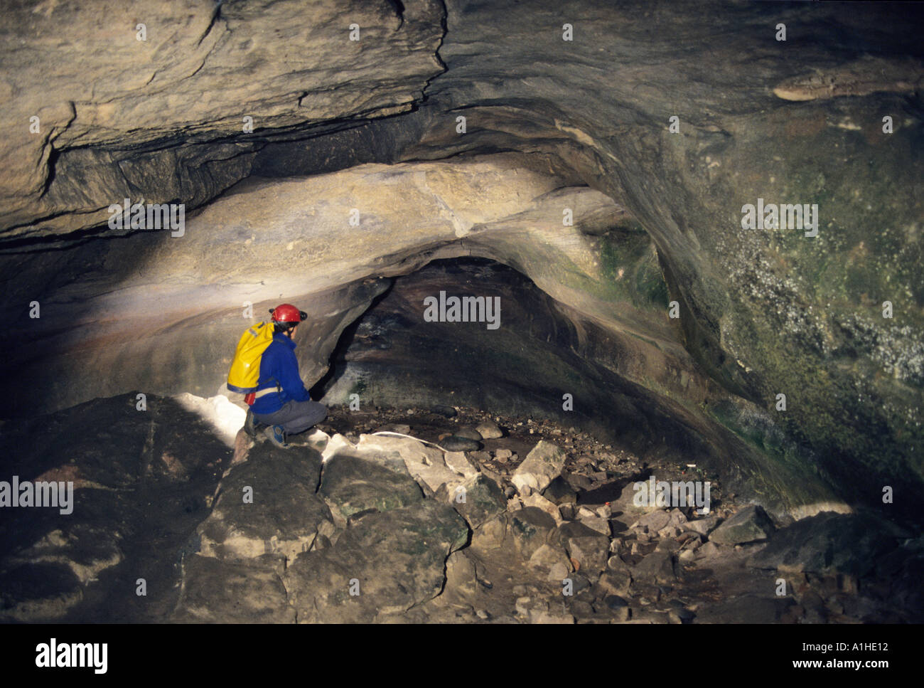 Female caver in Sliding or Sloping Cave Wemyss Caves Fife Scotland UK ...