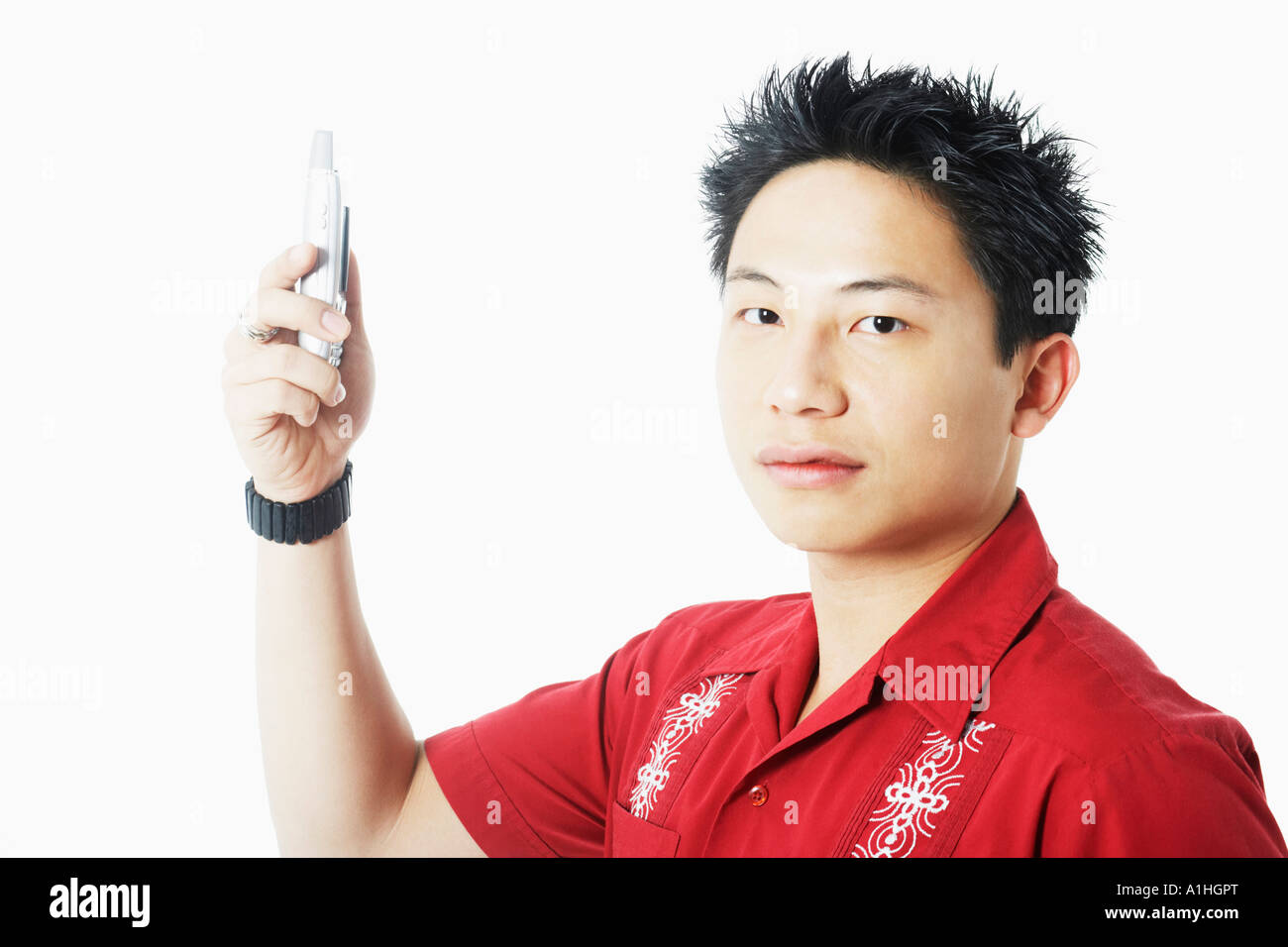 Portrait of a young man holding a mobile phone Stock Photo - Alamy