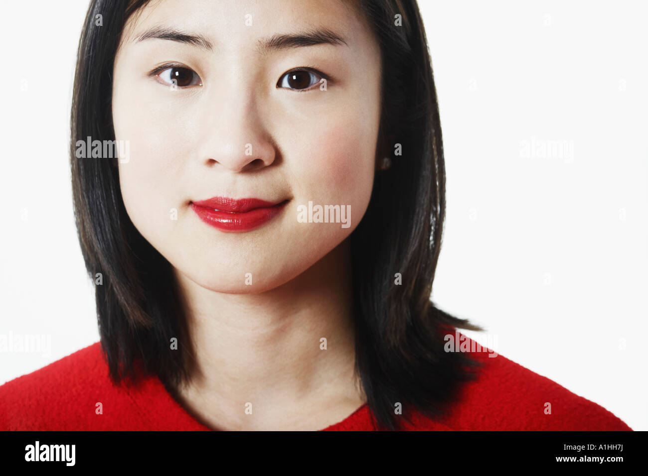 Portrait of a young woman grinning Stock Photo - Alamy