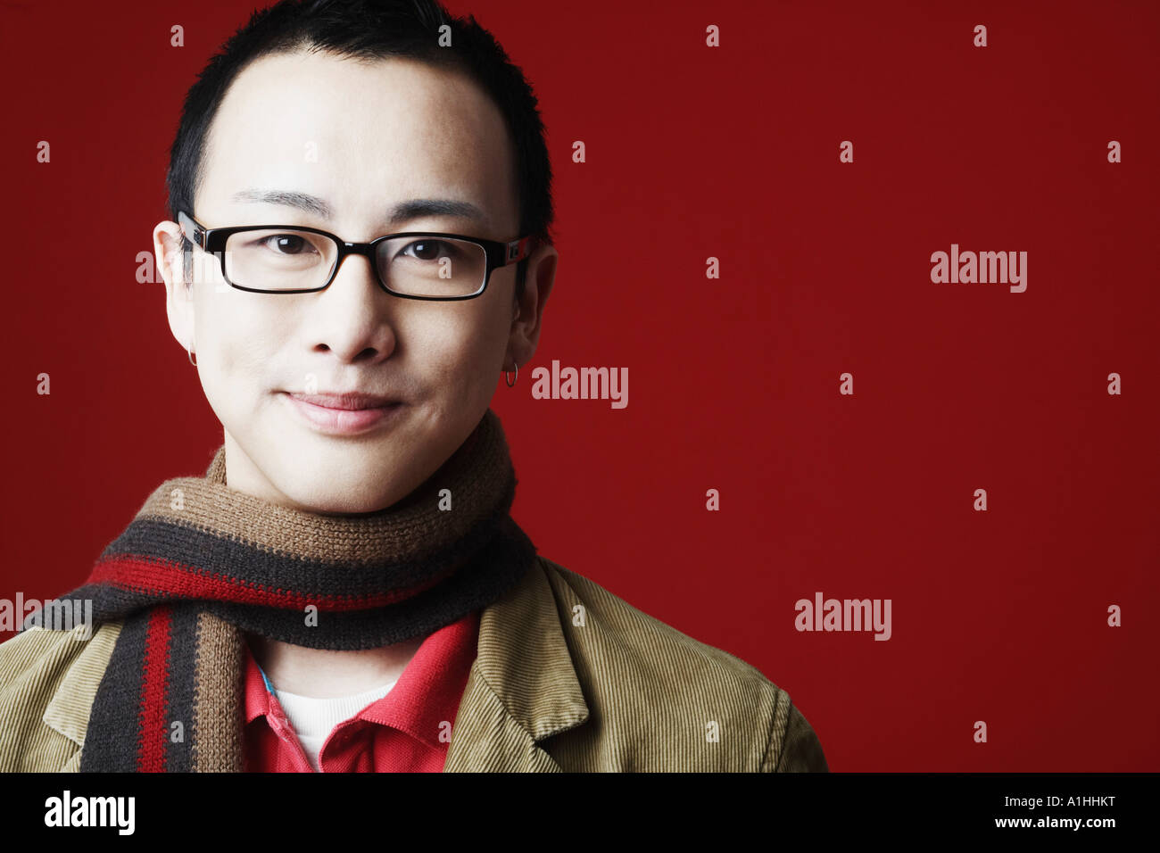 Portrait of a young man grinning Stock Photo - Alamy