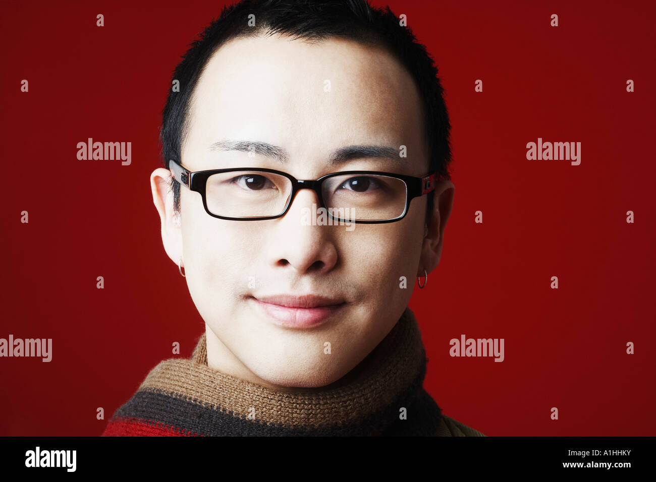 Portrait of a young man grinning Stock Photo - Alamy