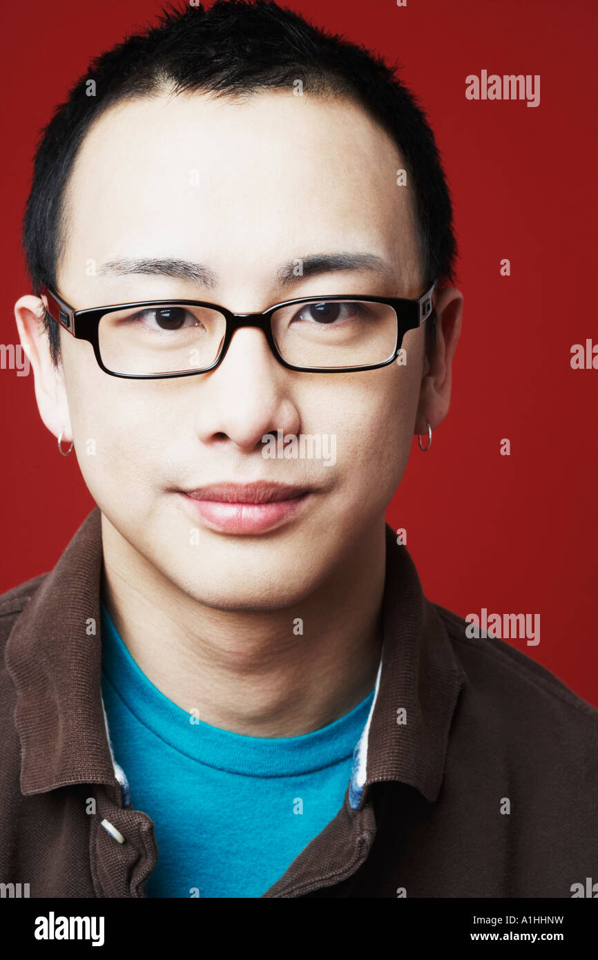 Portrait of a young man grinning Stock Photo - Alamy