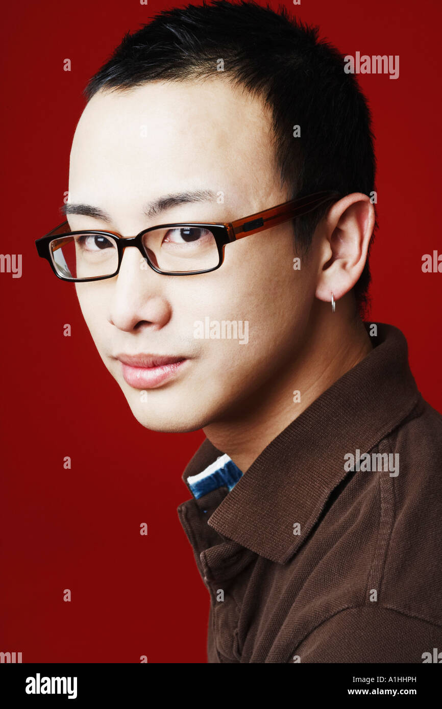 Portrait of a young man grinning Stock Photo - Alamy