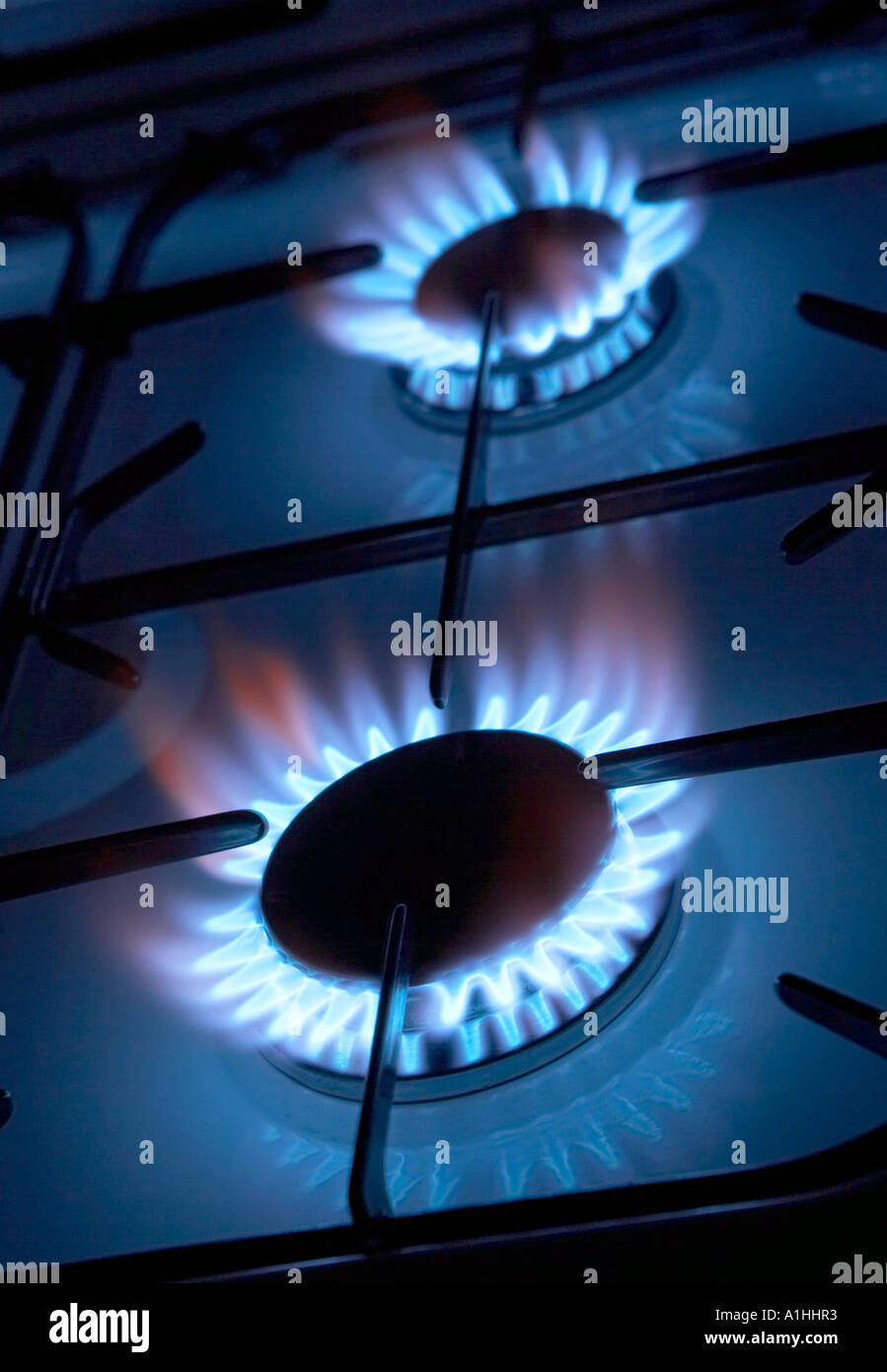 TWO BURNING RINGS ON GAS COOKER HOB Stock Photo - Alamy