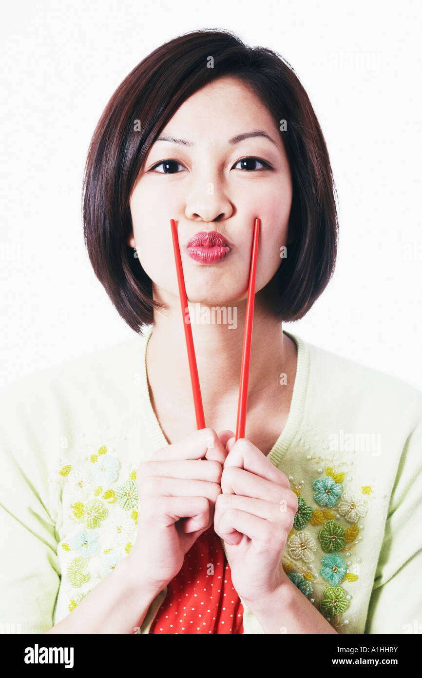 Young asian woman puckering lips hi-res stock photography and images ...
