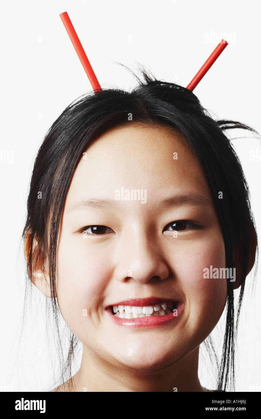 Portrait of a teenage girl clenching her teeth Stock Photo - Alamy