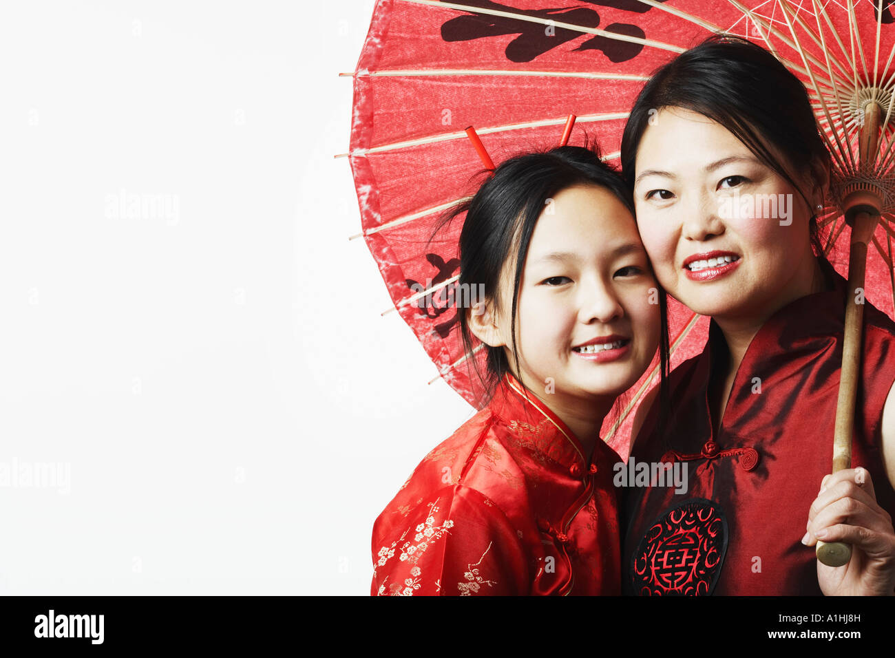 Portrait of a mother and her daughter smiling Stock Photo - Alamy