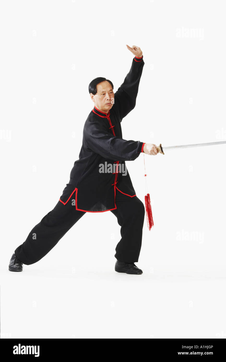 Chinese man holding sword looking hi-res stock photography and images ...