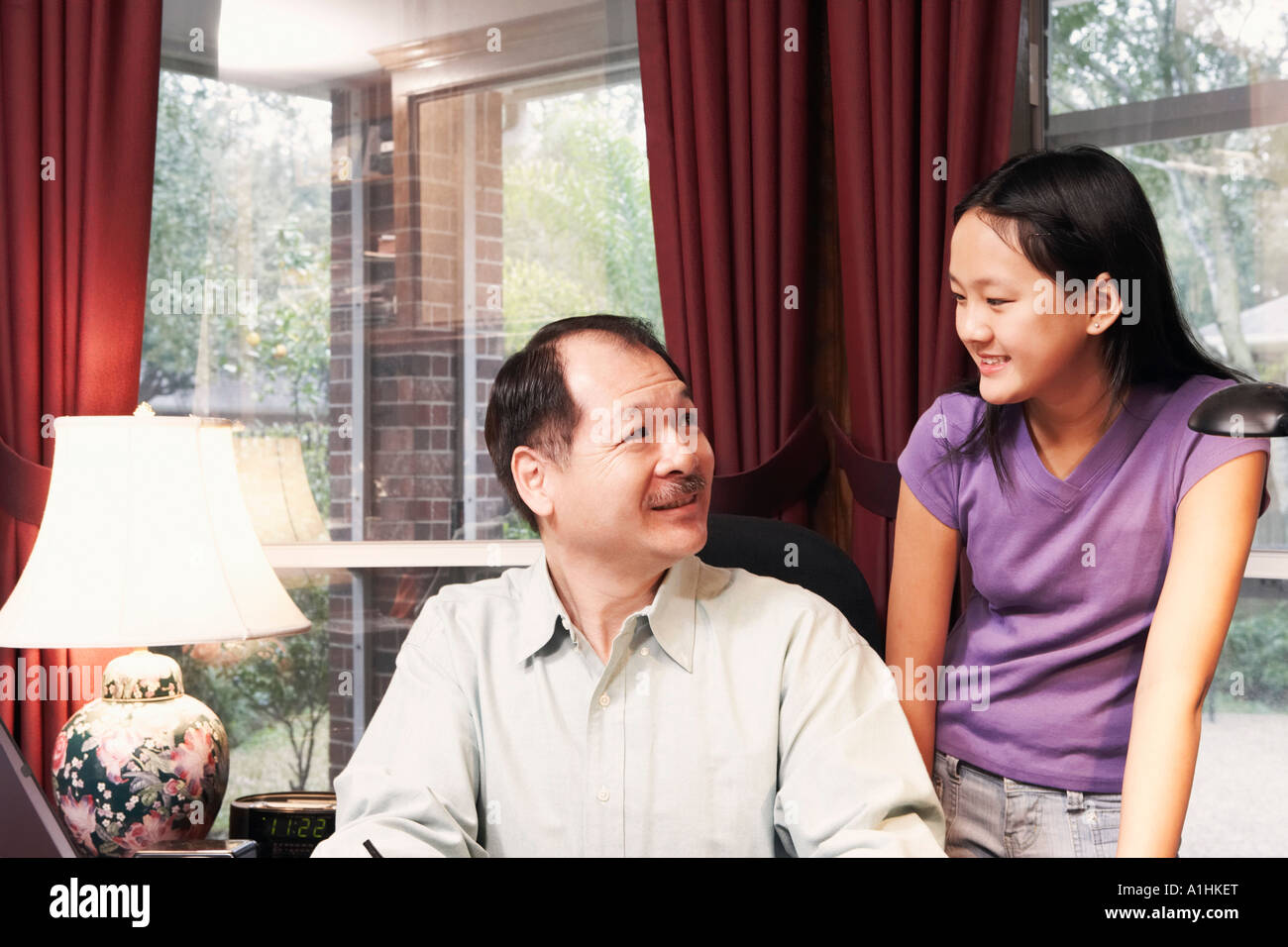 Close-up of a father talking to his daughter Stock Photo - Alamy