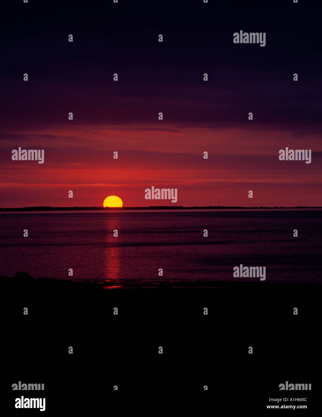 sunset descending below the horizon off irelands west coast Stock Photo ...