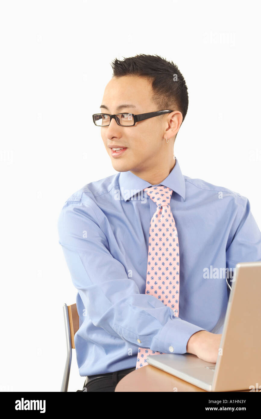 Young man laptop looking sideways hi-res stock photography and images ...