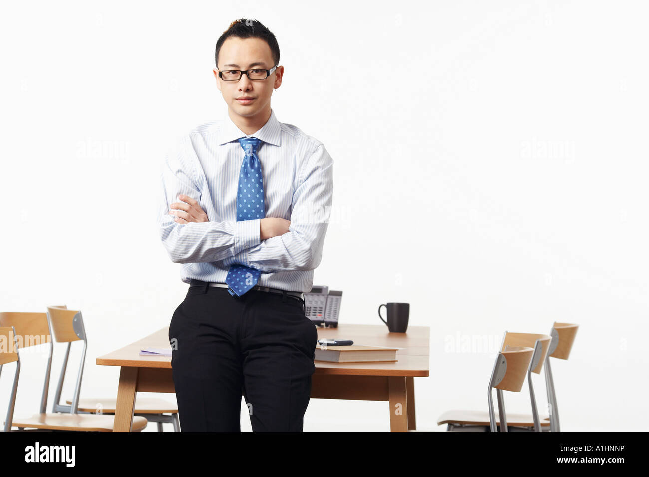 Portrait of a businessman looking serious Stock Photo - Alamy