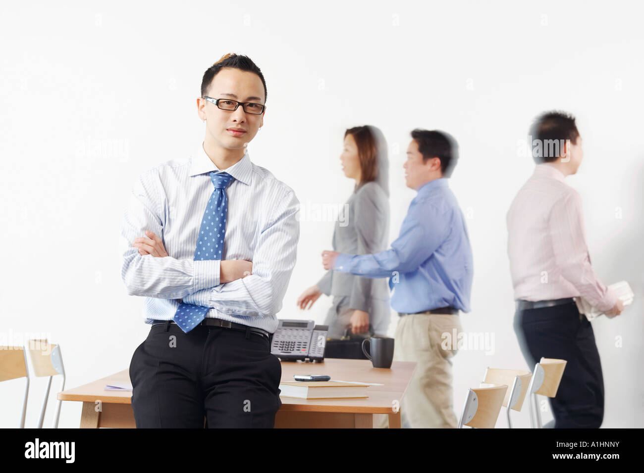 Portrait of a businessman looking serious Stock Photo - Alamy