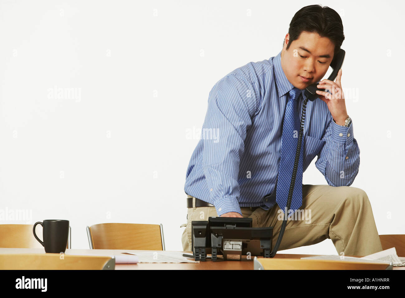 Young businessman telephoning while hi-res stock photography and images ...
