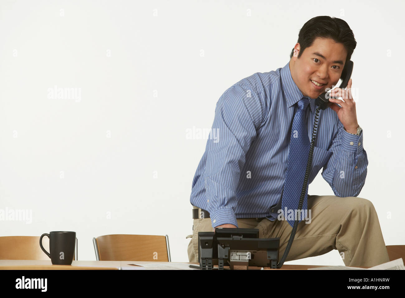 Portrait of a businessman using the telephone Stock Photo - Alamy