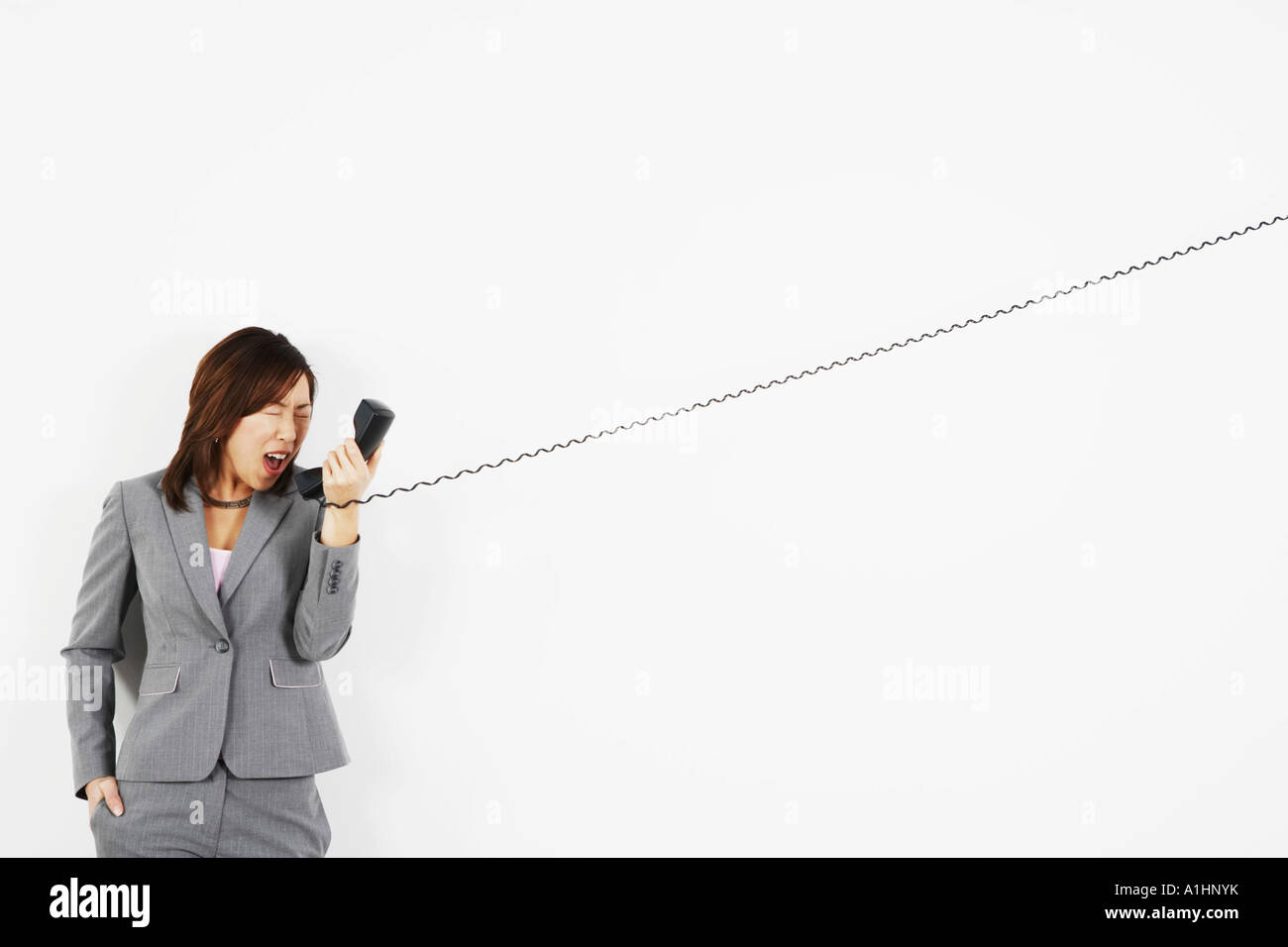 Angry asian woman shouting telephone hi-res stock photography and ...