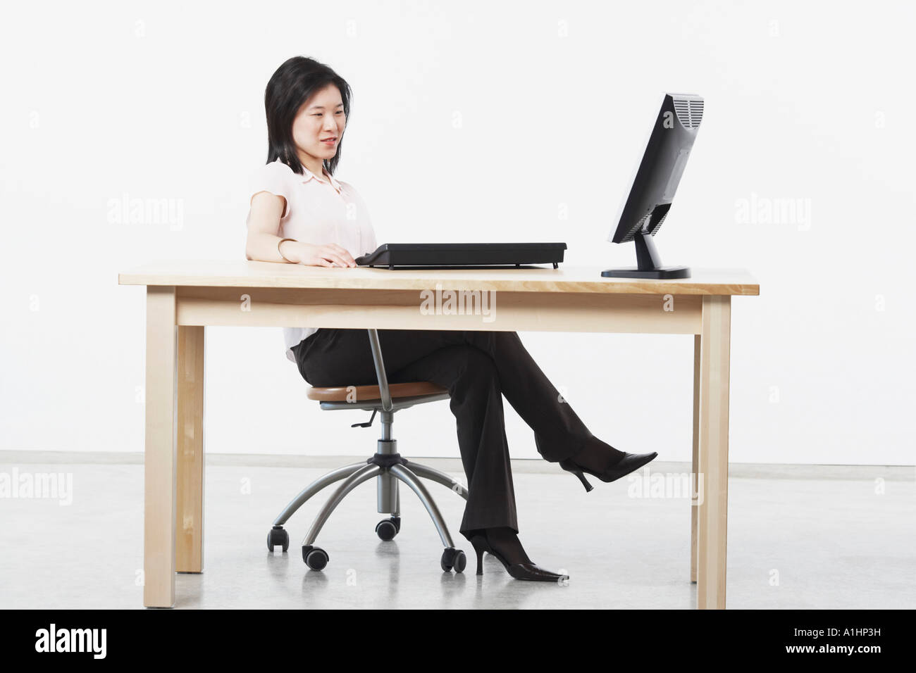 Side profile of a businesswoman using a computer Stock Photo - Alamy