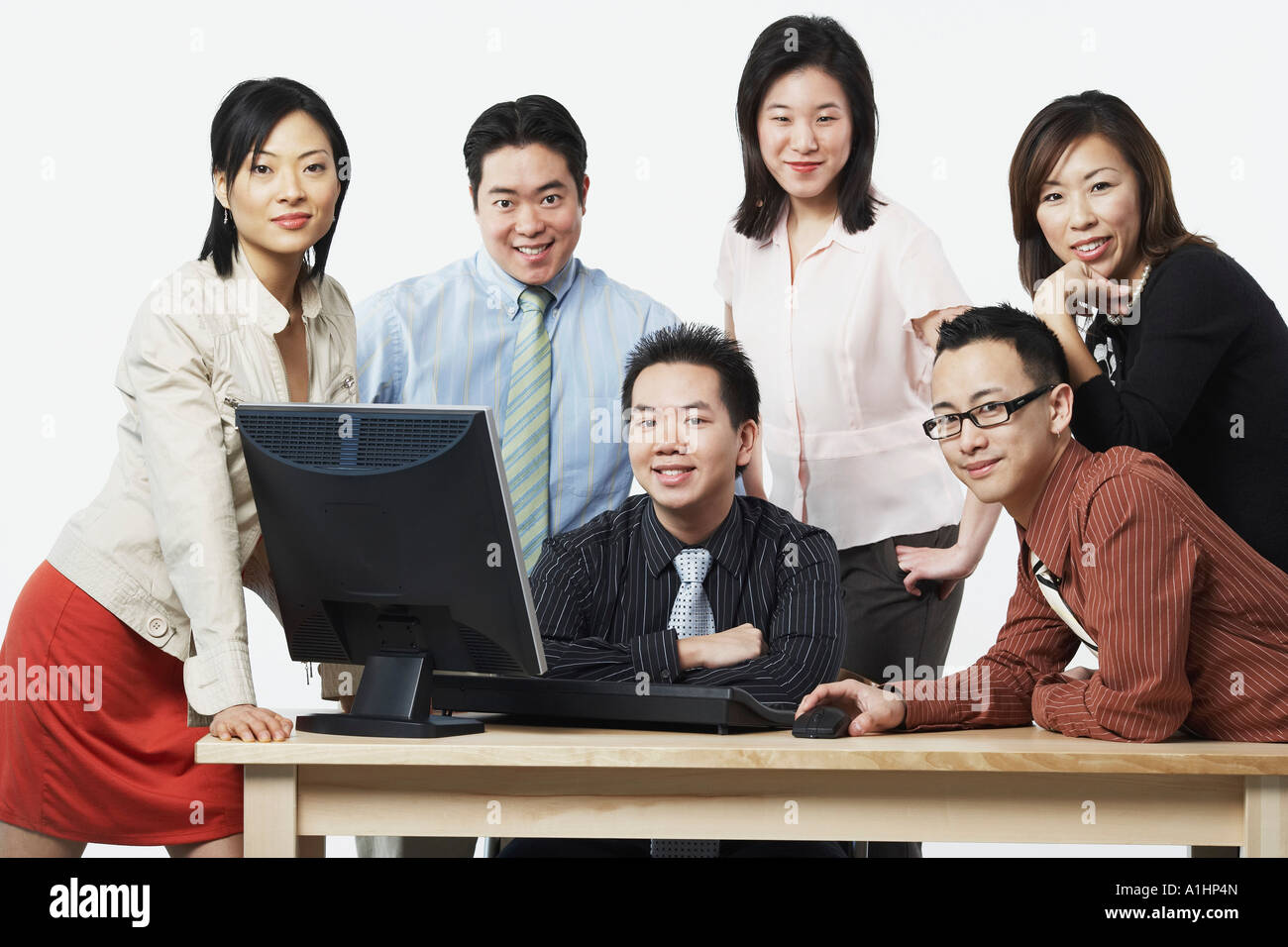 Group of people in front of a desktop pc hi-res stock photography and ...