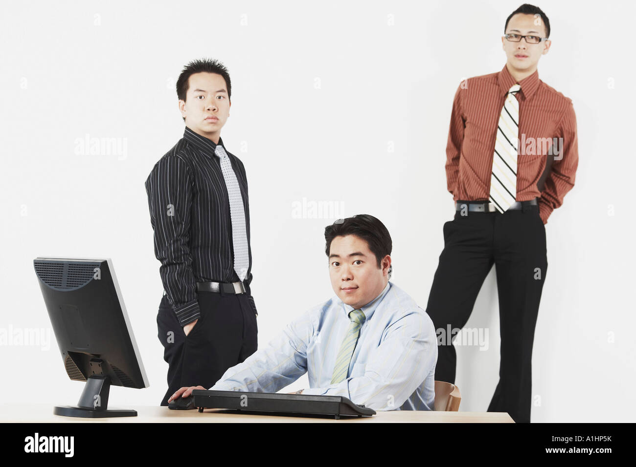 Portrait of three businessmen in an office Stock Photo - Alamy