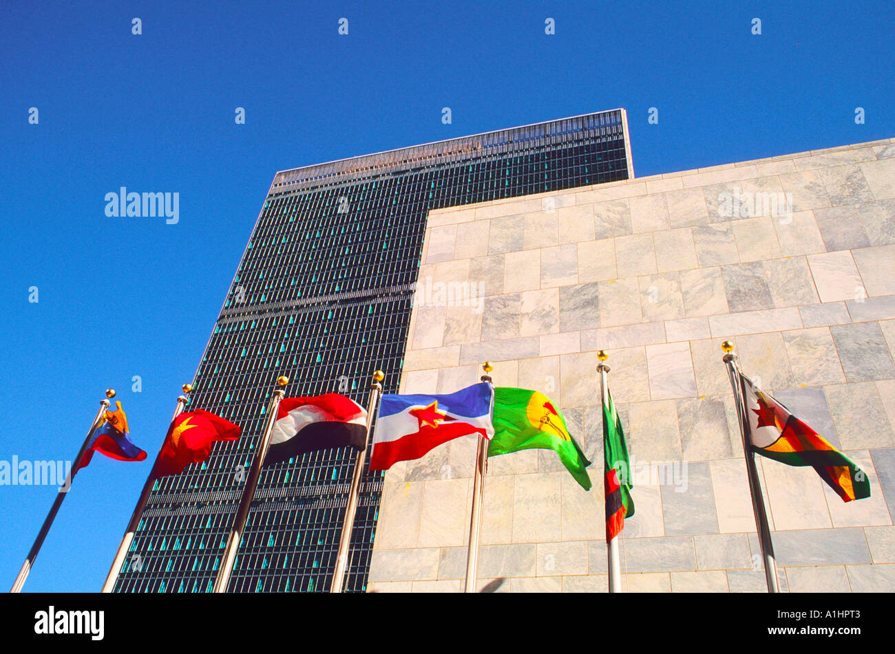 New York City The United Nations Secretariat building exterior and international flags. Midtown ...