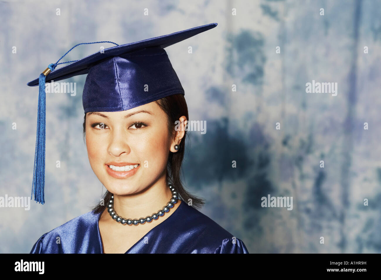 Portrait of a female graduate smiling Stock Photo - Alamy