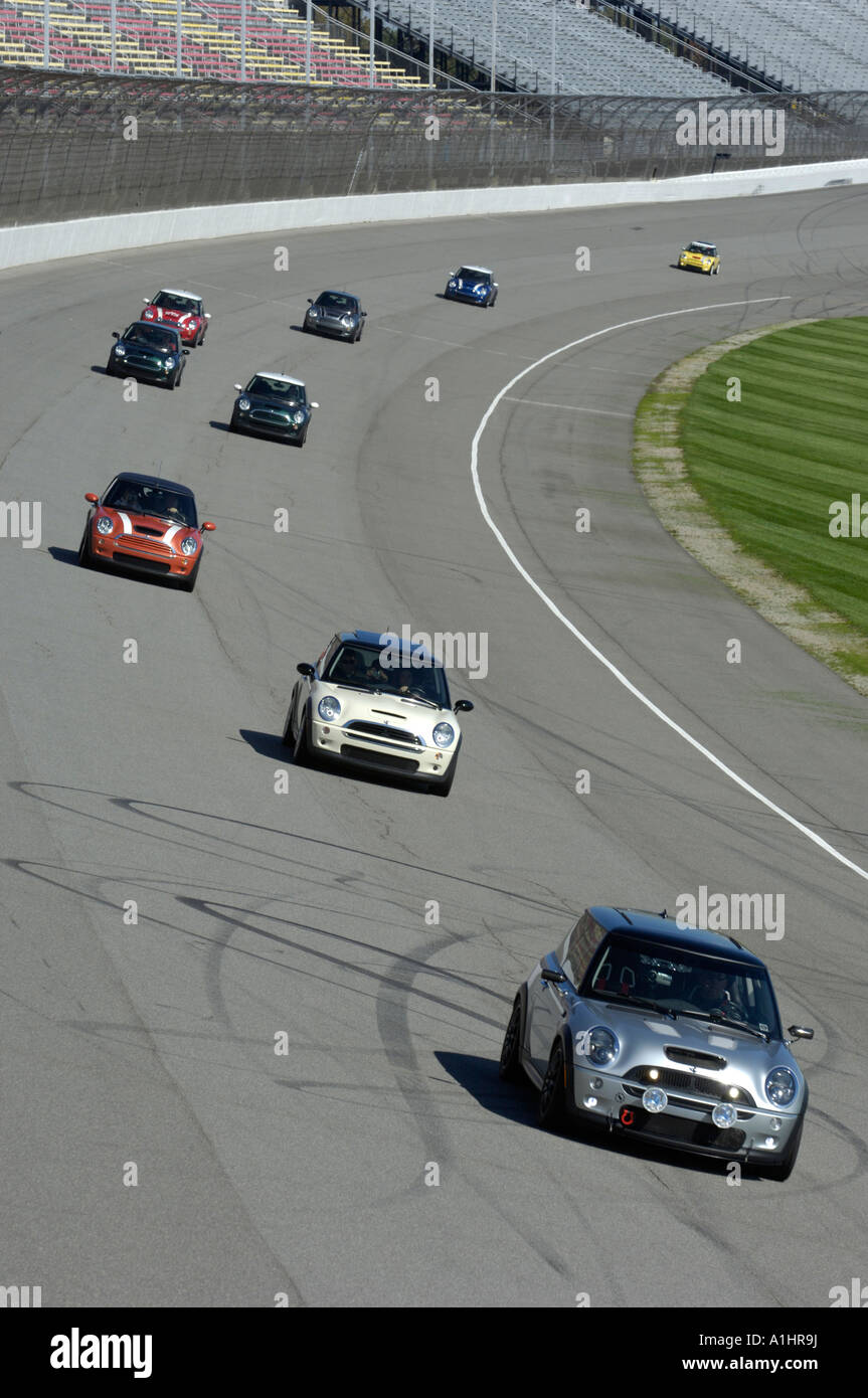 MINI Coopers doing touring laps at a club day at Michigan International ...