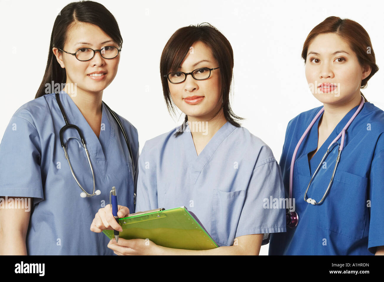 Portrait of three female doctors standing together Stock Photo - Alamy