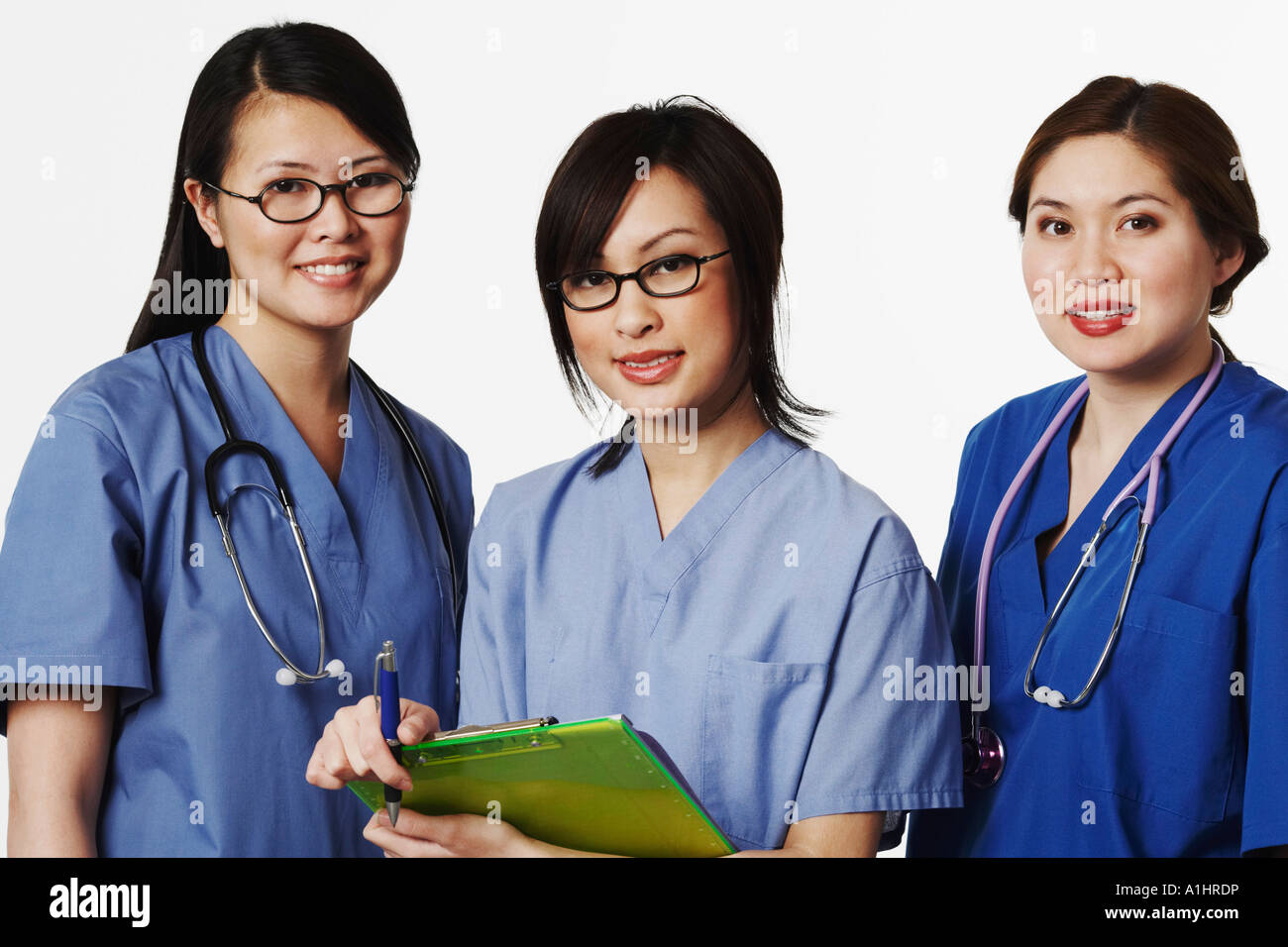 Portrait of three female doctors standing together Stock Photo - Alamy