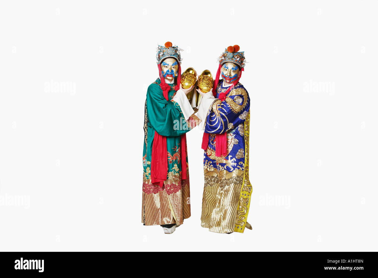 Portrait of two male Chinese opera performers holding bowls full of ...