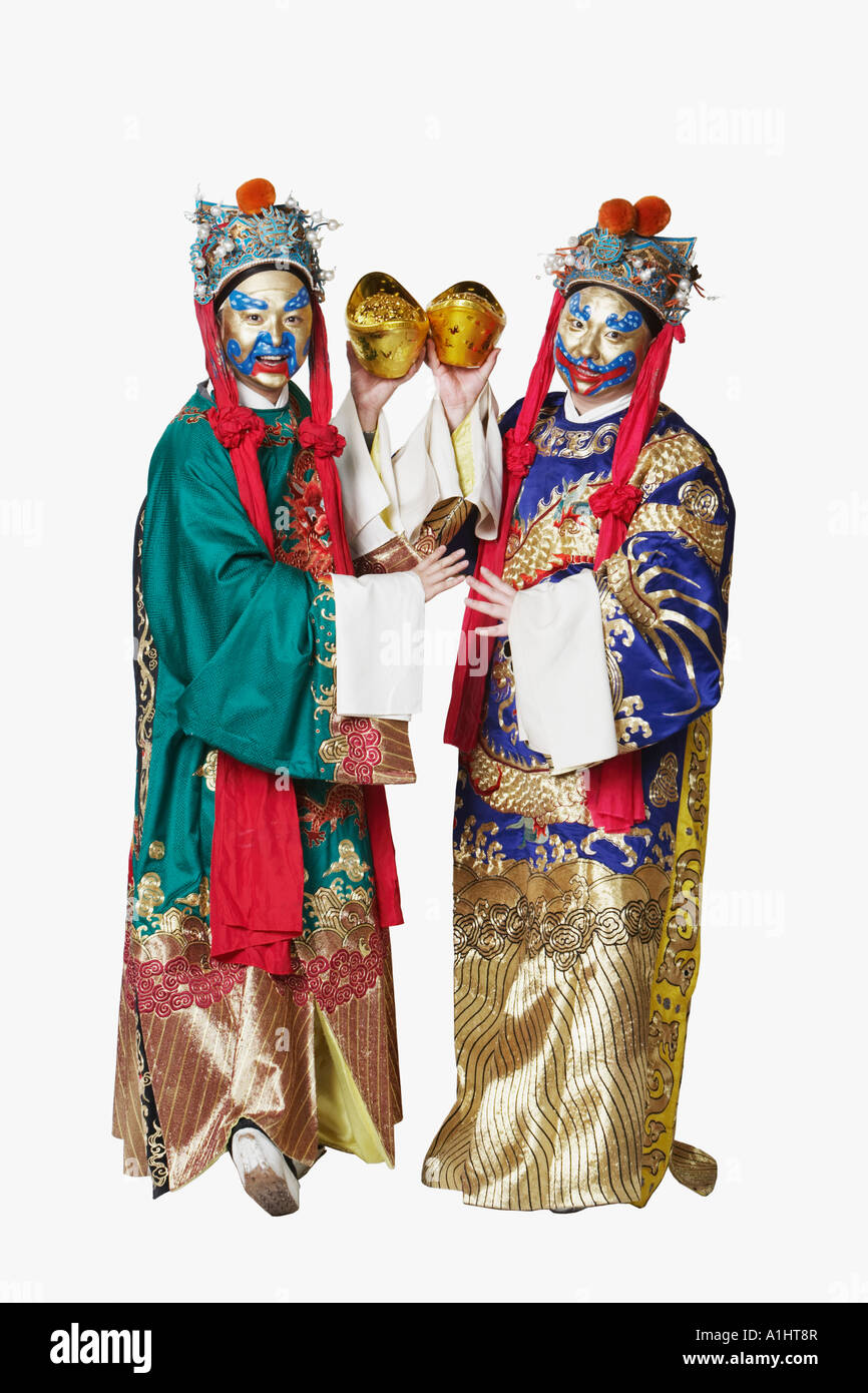Portrait of two male Chinese opera performers holding bowls full of ...