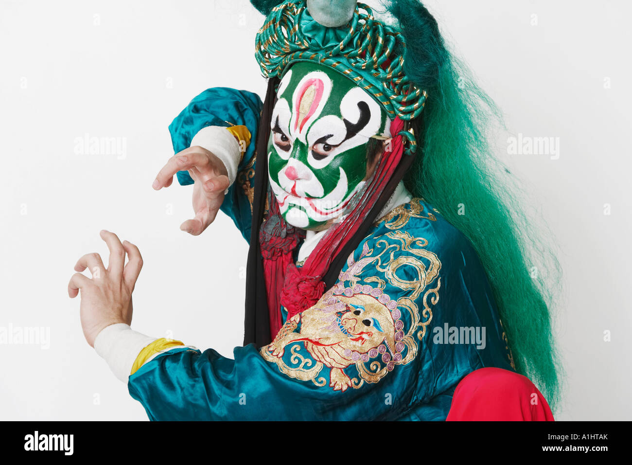 Portrait of a male Chinese opera performer gesturing with his hands ...