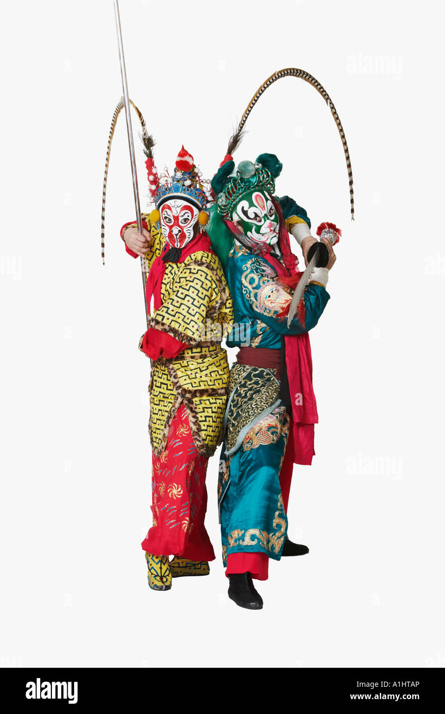 Side profile of two male Chinese opera performers gesturing with ...