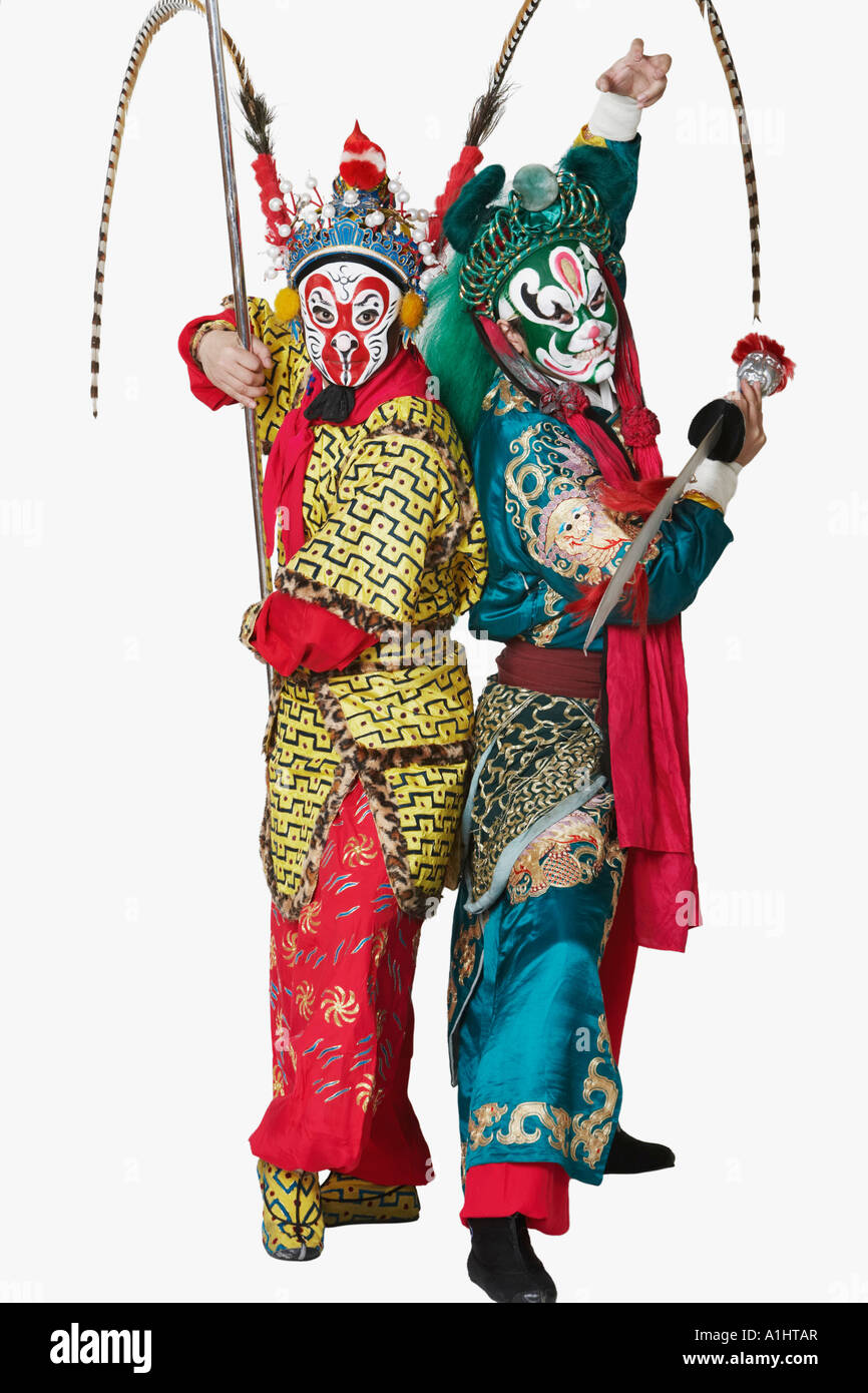 Side profile of two male Chinese opera performers gesturing with ...