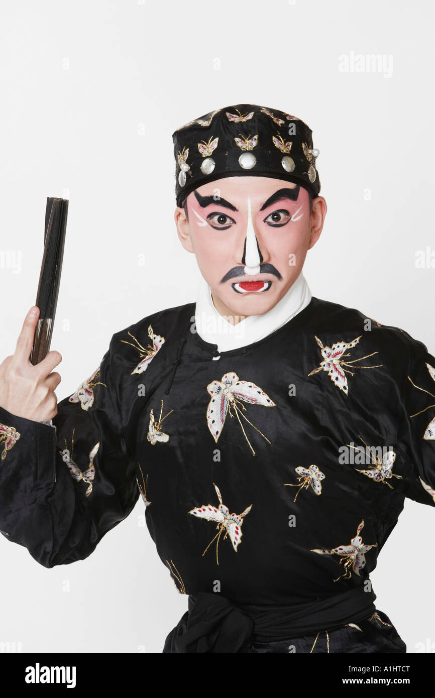 Portrait of a male Chinese opera performer holding a fan Stock Photo ...