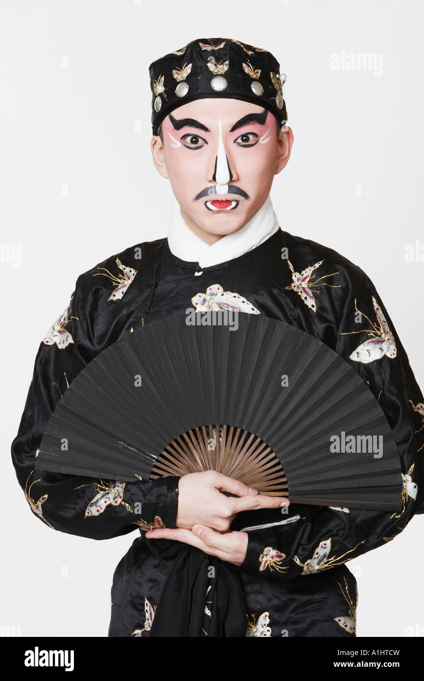 Portrait of a male Chinese opera performer holding a fan Stock Photo ...