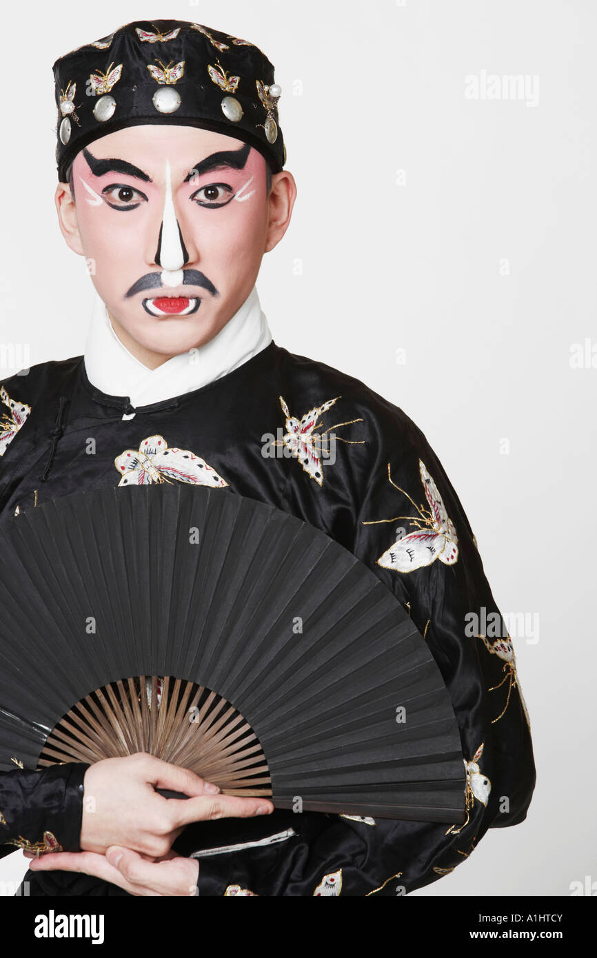 Portrait of a male Chinese opera performer holding a fan Stock Photo ...