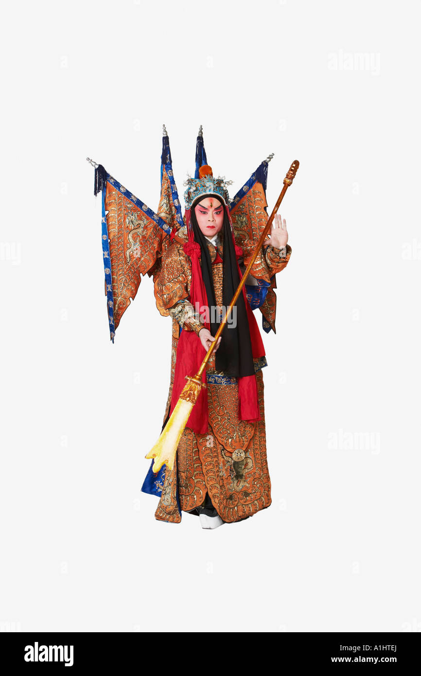 Portrait of a male Chinese opera performer holding a weapon Stock Photo ...
