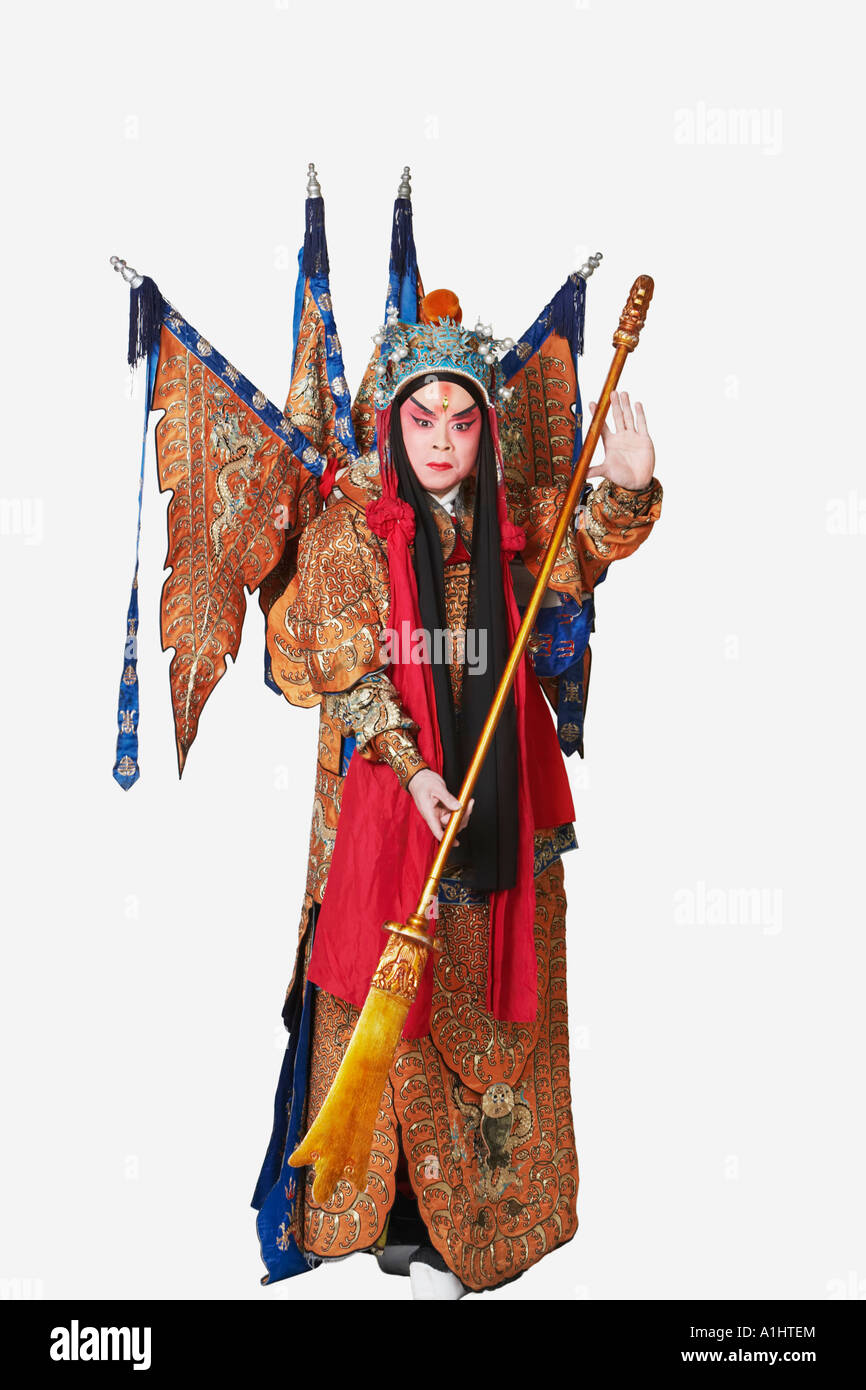 Portrait of a male Chinese opera performer holding a weapon Stock Photo ...