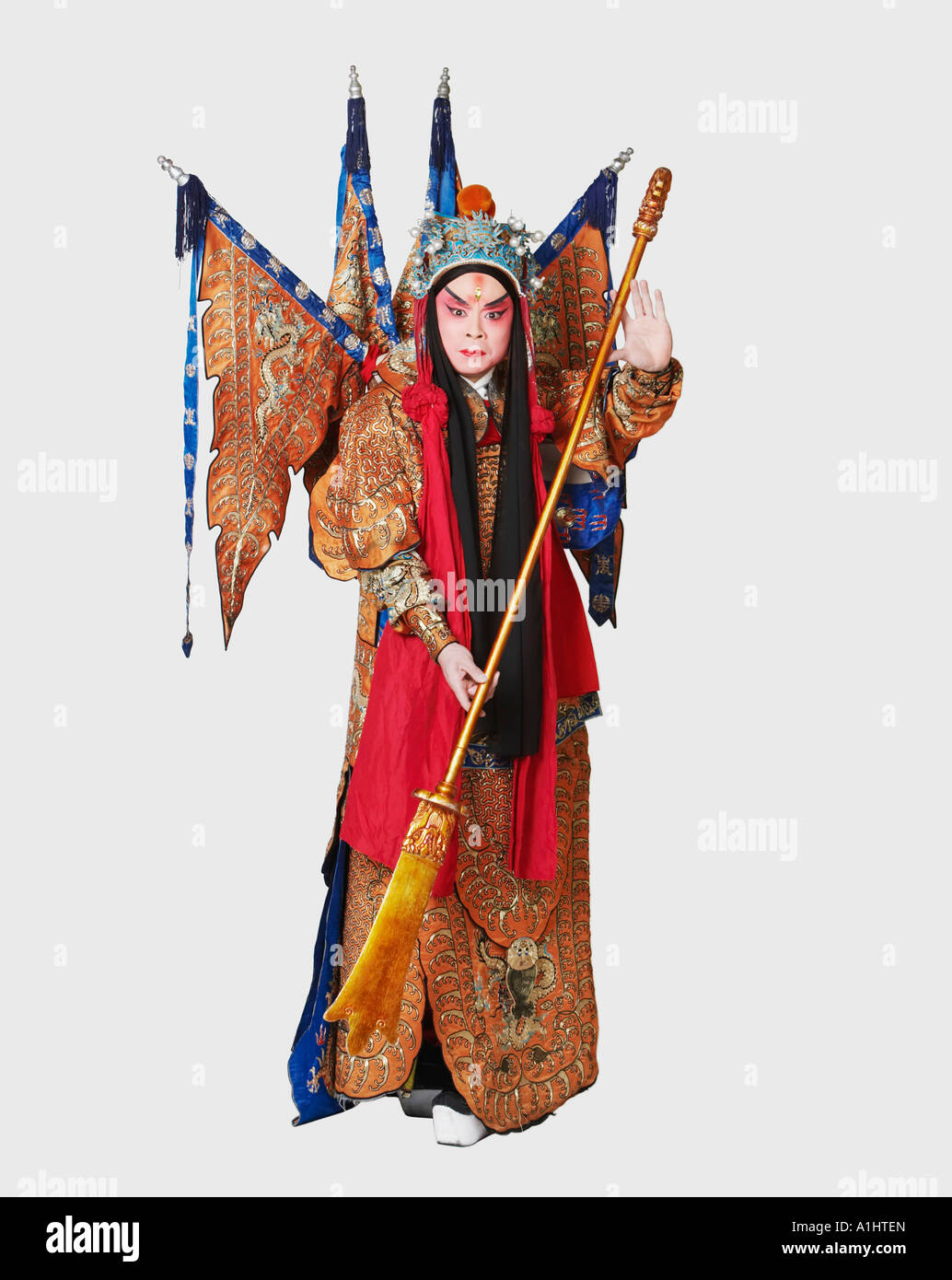Portrait of a male Chinese opera performer holding a weapon Stock Photo ...