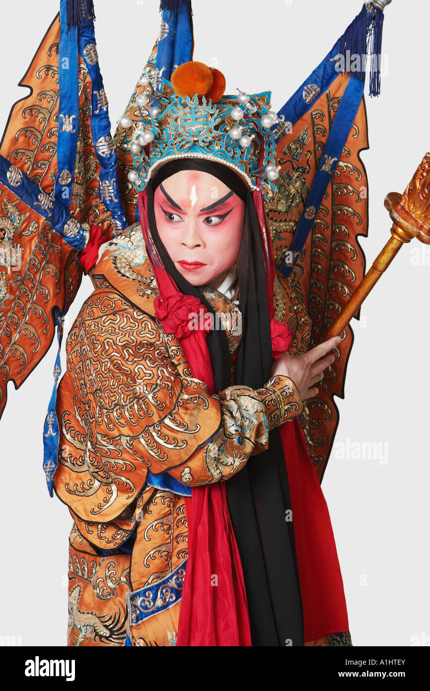 Close-up of a male Chinese opera performer holding a weapon Stock Photo ...