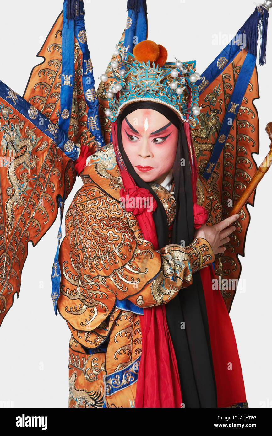 Close-up of a male Chinese opera performer holding a weapon Stock Photo ...