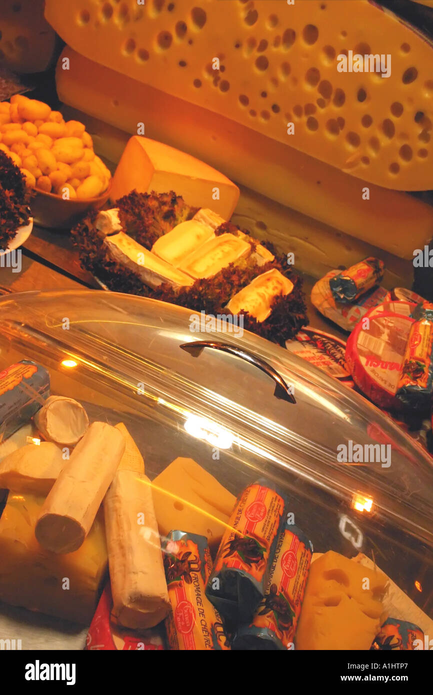 Variety of cheeses on display in shop window in the Latin Quarter of ...