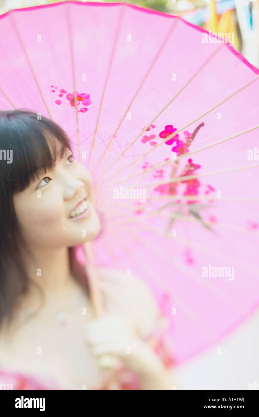 Woman holding a parasol hi-res stock photography and images - Alamy